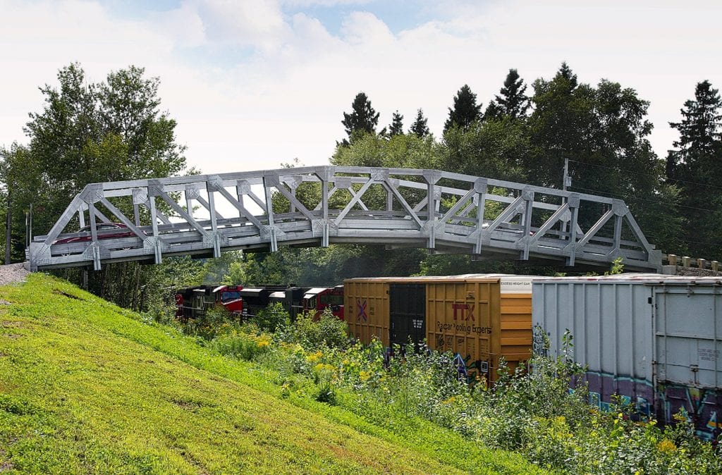 Algonquin rolls historic "knuckle" truss bridge replacement into place
